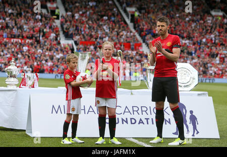 Michael Carrick speaks next to his children Jacey and Louise before his ...