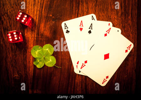 Gambling items on a wooden table Stock Photo - Alamy