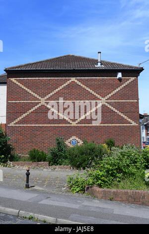 Artistic brickwork on side of residential house Stock Photo - Alamy