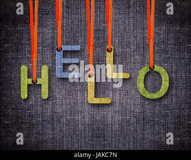 Hello Letters hanging strings with blue sackcloth background Stock ...
