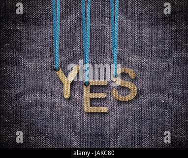 Yes Letters hanging strings with blue sackcloth background Stock Photo ...