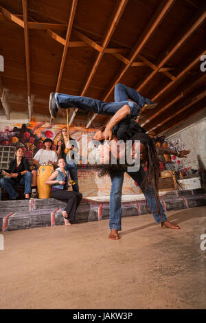 Capoeira man throwing partner over his shoulders Stock Photo - Alamy
