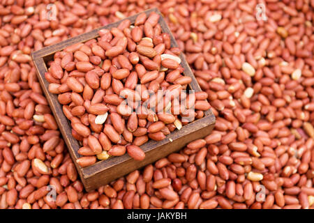 Peanut kernels with wooden container Stock Photo - Alamy