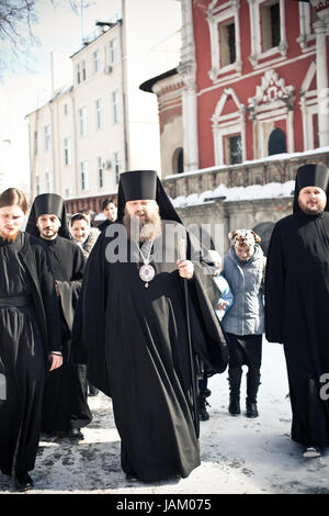Russian Orthodox priests walk in the courtyard of the 17th century ...
