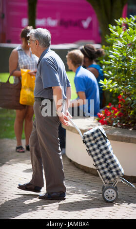 old man shopping with funny trolly Stock Photo - Alamy