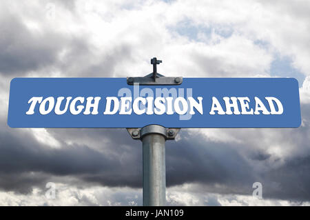 Tough decision ahead road sign with building facade Stock Photo - Alamy