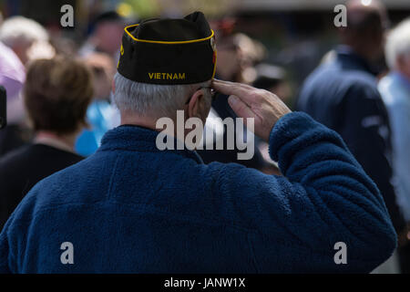 Old man saluting with hat, isolated on black Stock Photo - Alamy
