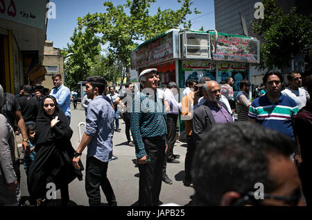 Tehran, Iran. 7th June, 2017. People gather outside Iran's parliament ...
