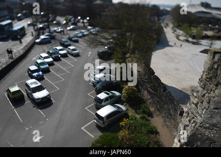 tilt shift effect aerial photography of traffic and road with busses ...