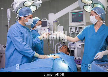 Patient being operated by the surgeons in operation theatre Stock Photo ...