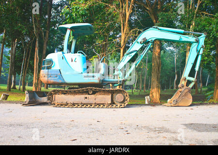 Back Hoe construction machinery equipment standing in construction site ...