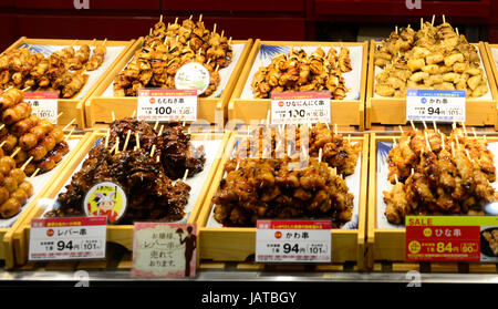 Yakitori and other Japanese grilled meat on skewers on display in a ...