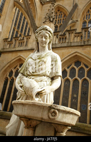 Statue of a woman pouring water outside Bath Abbey Stock Photo - Alamy