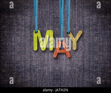 May letters hanging strings with blue sackcloth background Stock Photo ...