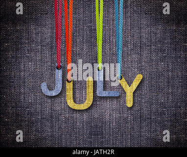 July letters hanging strings with blue sackcloth background Stock Photo ...
