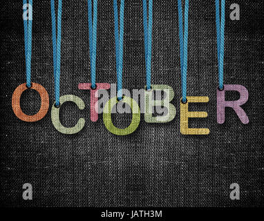 October letters hanging strings with blue sackcloth background Stock ...