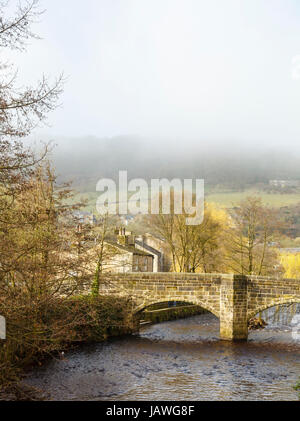 Hebden Beck runs under the 16th Century Packhorse Bridge in the centre ...