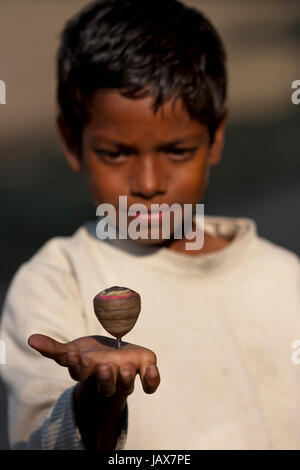 Rural children play traditional game called Dariabanda” at Singair ...