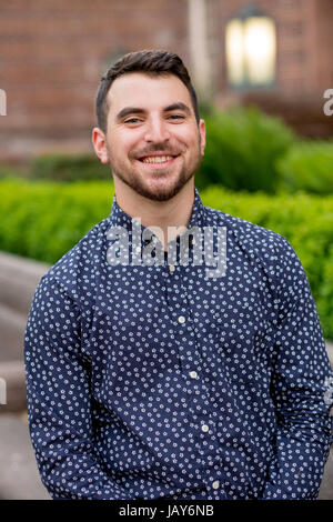 Portrait of male graduating student outdoors Stock Photo - Alamy