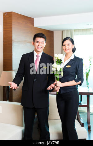 Hotel Manager or director and supervisor welcome arriving VIP guests ...