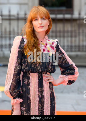 Florence Welch, lead singer of Florence and the Machine, shows off her trademark red hair and ...