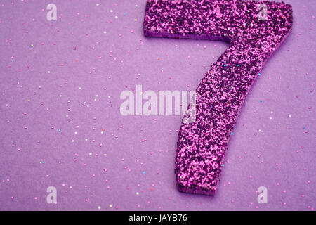 Number seven purple color over a red background. Anniversary. Vertical ...