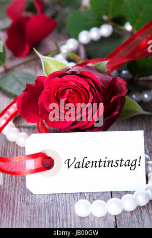 German word luck on wooden blocks and decoration on a green background ...