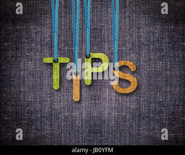 Tips Letters hanging strings with blue sackcloth background Stock Photo ...