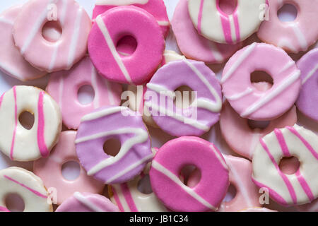 colourful spread of Fox's mini party rings biscuits set on white ...