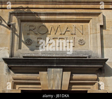 Stone carved sign at the Roman Baths with the Bath Abbey in the ...
