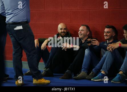 Sinn Fein candidate Chris Hazzard (left) after winning the South Down ...