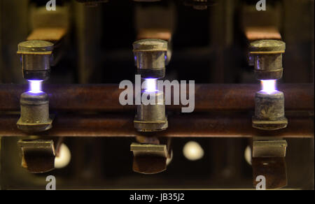 Electric relay with sparks jumping between the contacts, due to ...