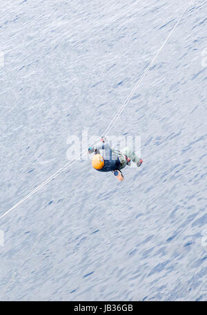 Climber crossing gorge by tyrolean traverse, Estes Park, Colorado Stock ...