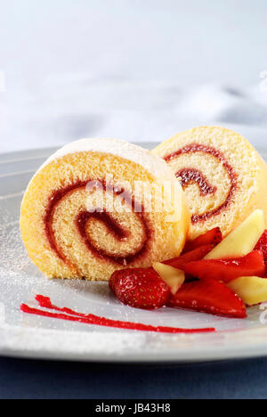 Two slices of strawberry jam Swiss roll Stock Photo - Alamy