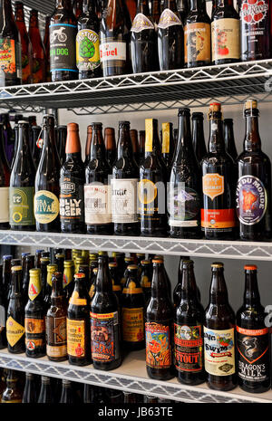 Beer bottles on shelves Stock Photo - Alamy