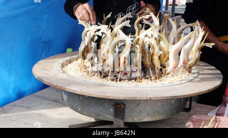 Traditional Japanese grilled fish skewers at Tsukiji Fish Market Stock ...