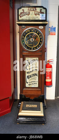 A vintage Try your weight machine Stock Photo - Alamy