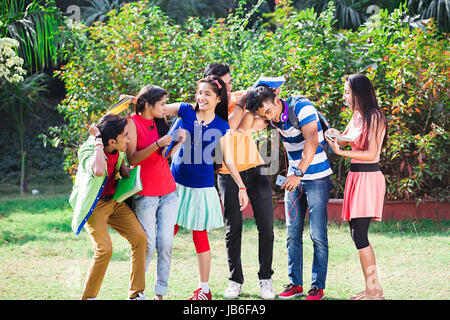 Group of college students having fun Stock Photo - Alamy