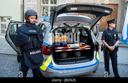 Two members of the German police present the new protective gear of the ...