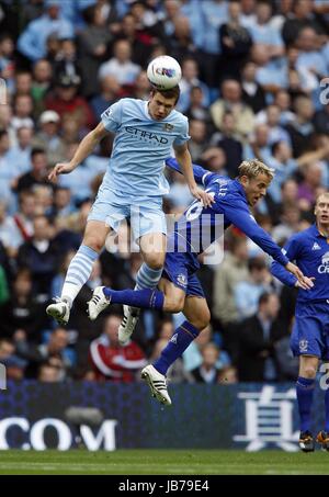 Edin Dzeko of Manchester City and Phil Jagielka of Everton during the ...
