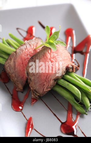 Slices of roast beef and string beans Stock Photo - Alamy