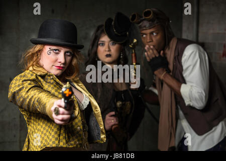 Steam Punks in Underground Lair with Retro Phone Stock Photo - Alamy