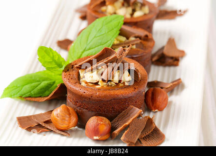 Mini chocolate cakes with hazelnut filling Stock Photo - Alamy