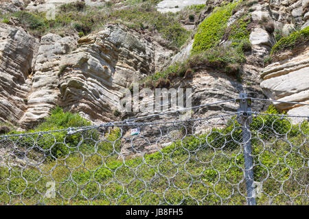 Steel wire nets fence installed against rockfall landslide protection ...