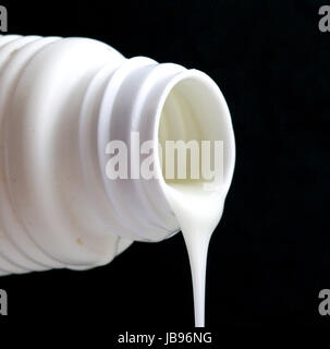 image of a Shampoo pouring out from the bottle Stock Photo - Alamy