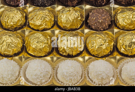 Fragment of the open blue boxes of chocolates. Presented on a white ...