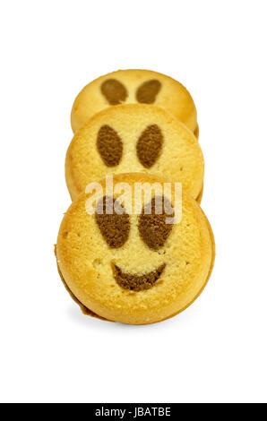 Three biscuits with images of eyes and mouth as a smiley face isolated ...