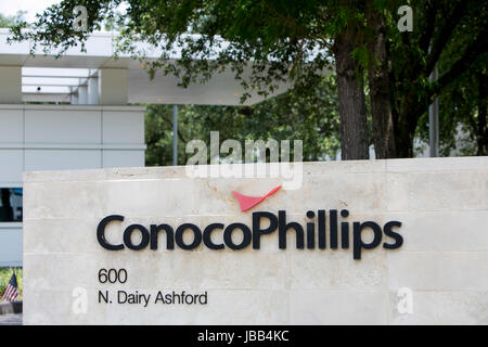A logo sign outside of the headquarters of the ConocoPhillips Co., in ...