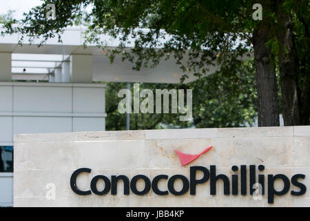 A logo sign outside of the headquarters of the ConocoPhillips Co., in ...
