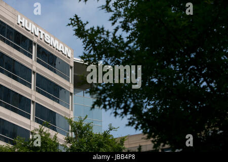 A logo sign outside of the headquarters of the Huntsman Corporation in ...